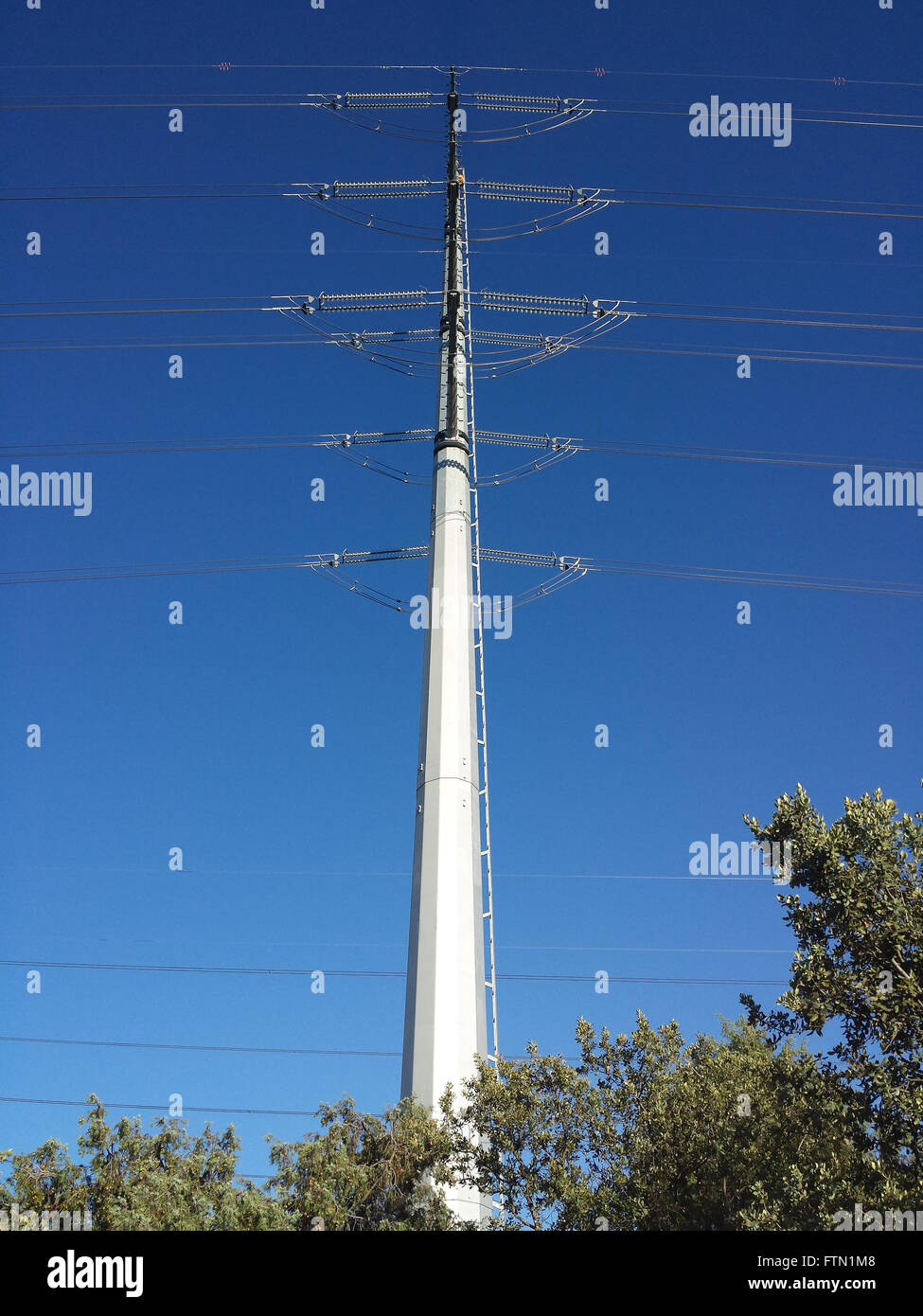 Modern electric tower on blue sky Stock Photo - Alamy