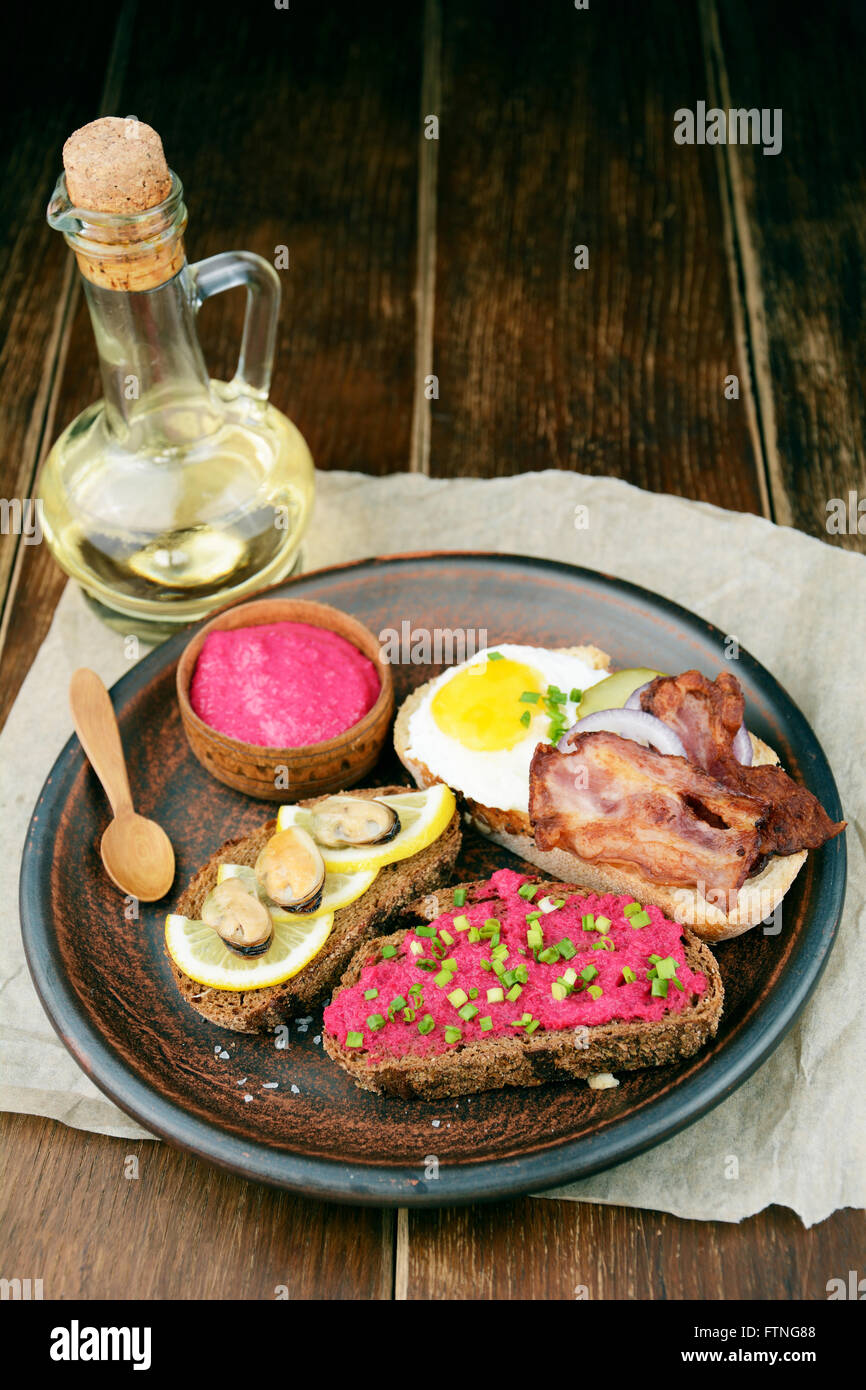 Tasty homemade tapas with different fillings on the table Stock Photo ...