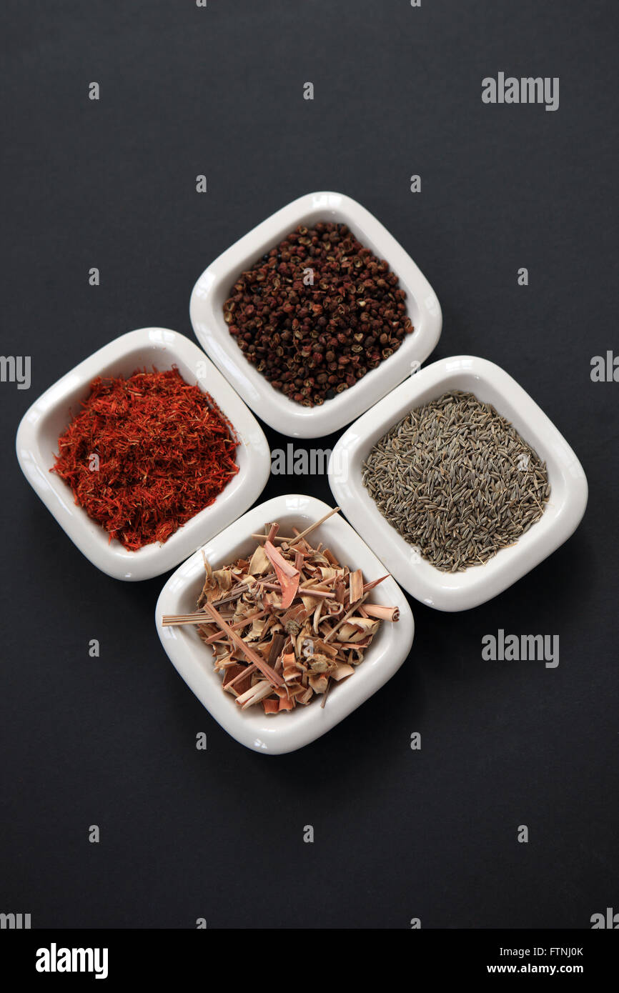 Spices in small white dishes Stock Photo - Alamy
