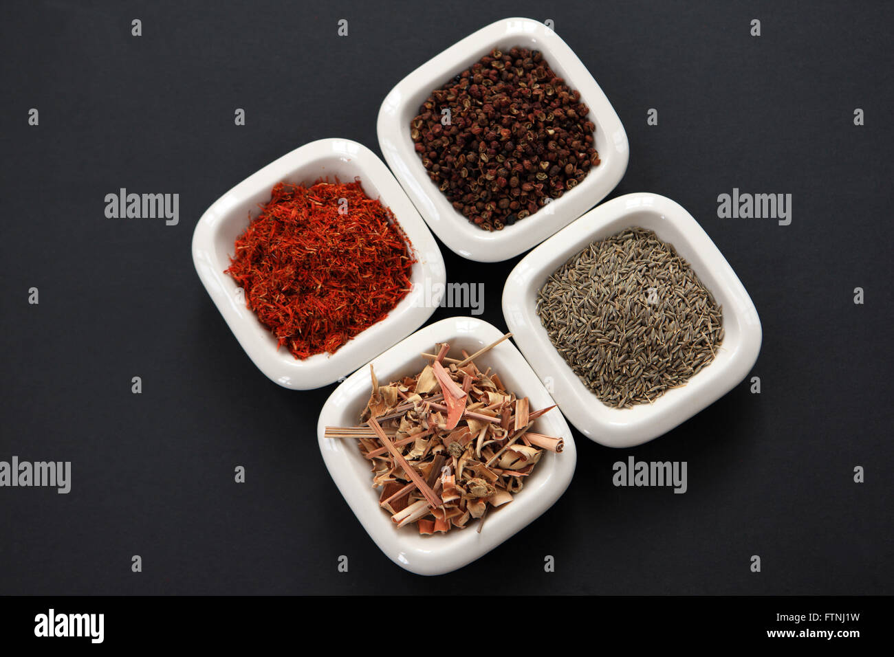 Spices in small white dishes, ready for adding to cooking Stock Photo ...