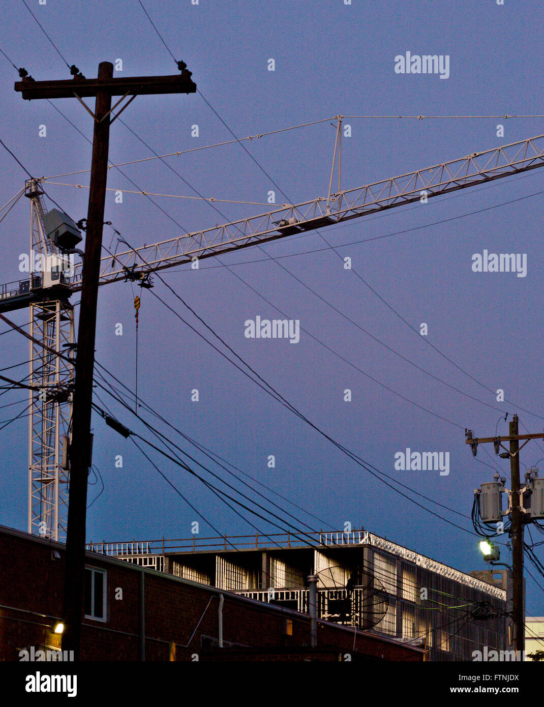 Crane and telegraph wires in the evening light North Carolina USA NC ...