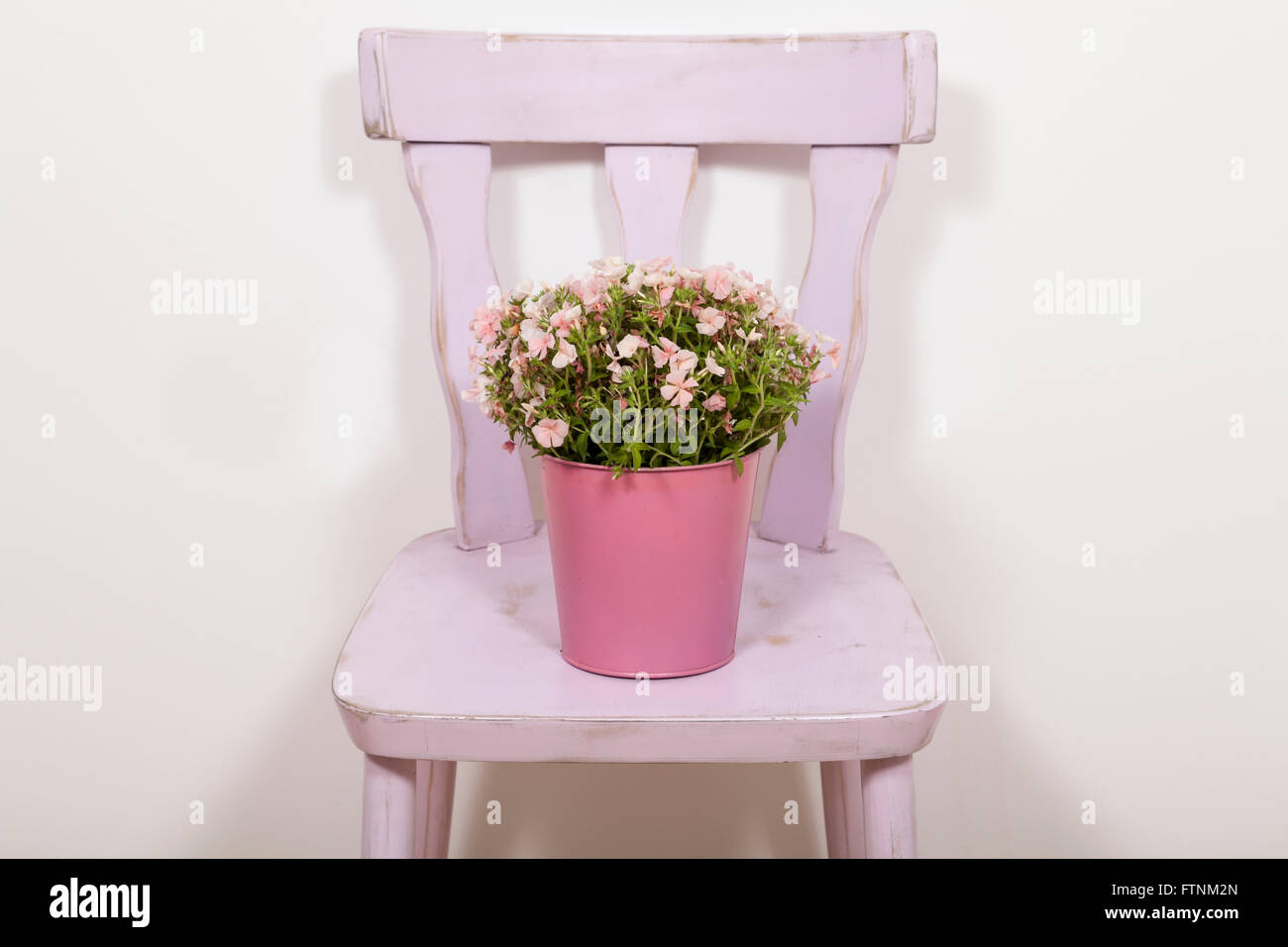 Chair flowers hi-res stock photography and images - Alamy