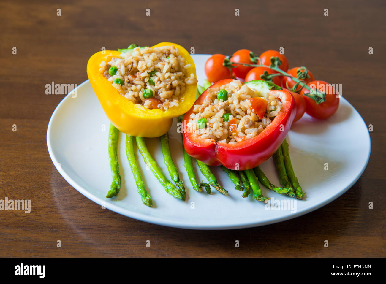 rice pilaf with colorful vegetable in red bell pepper Stock Photo - Alamy