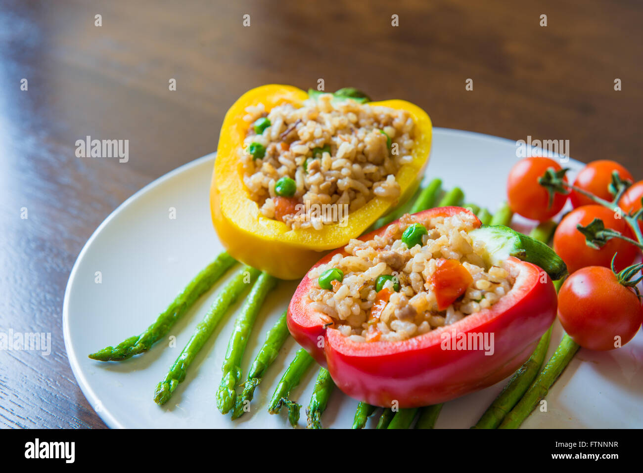rice pilaf with colorful vegetable in red bell pepper Stock Photo - Alamy