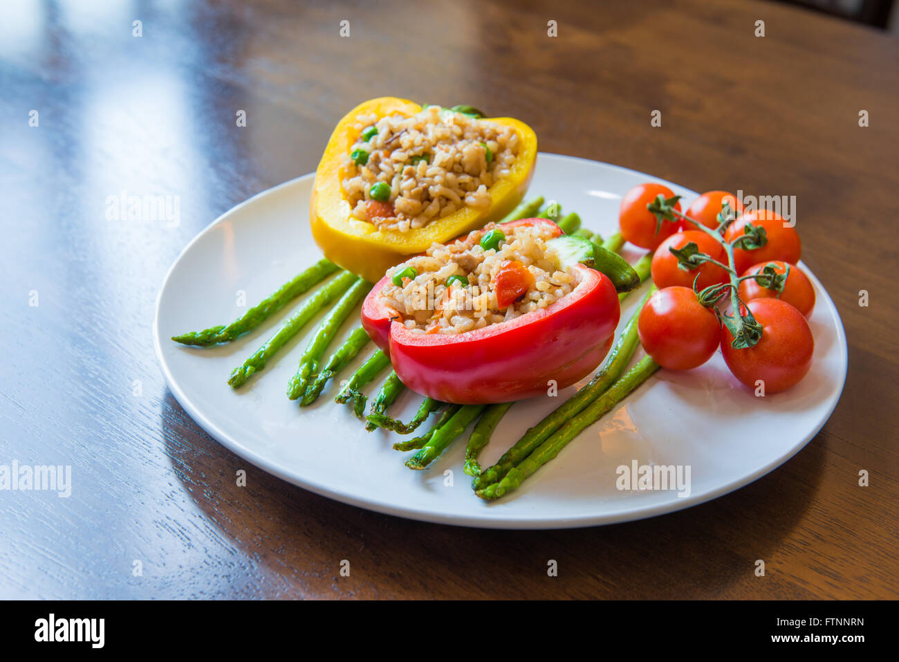 rice pilaf with colorful vegetable in red bell pepper Stock Photo - Alamy