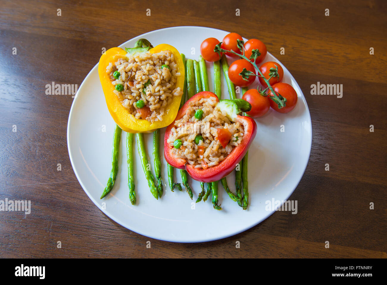 rice pilaf with colorful vegetable in red bell pepper Stock Photo - Alamy