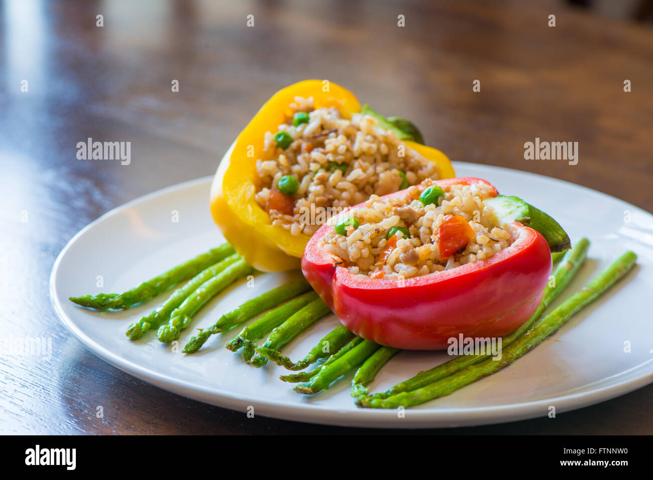 rice pilaf with colorful vegetable in red bell pepper Stock Photo - Alamy