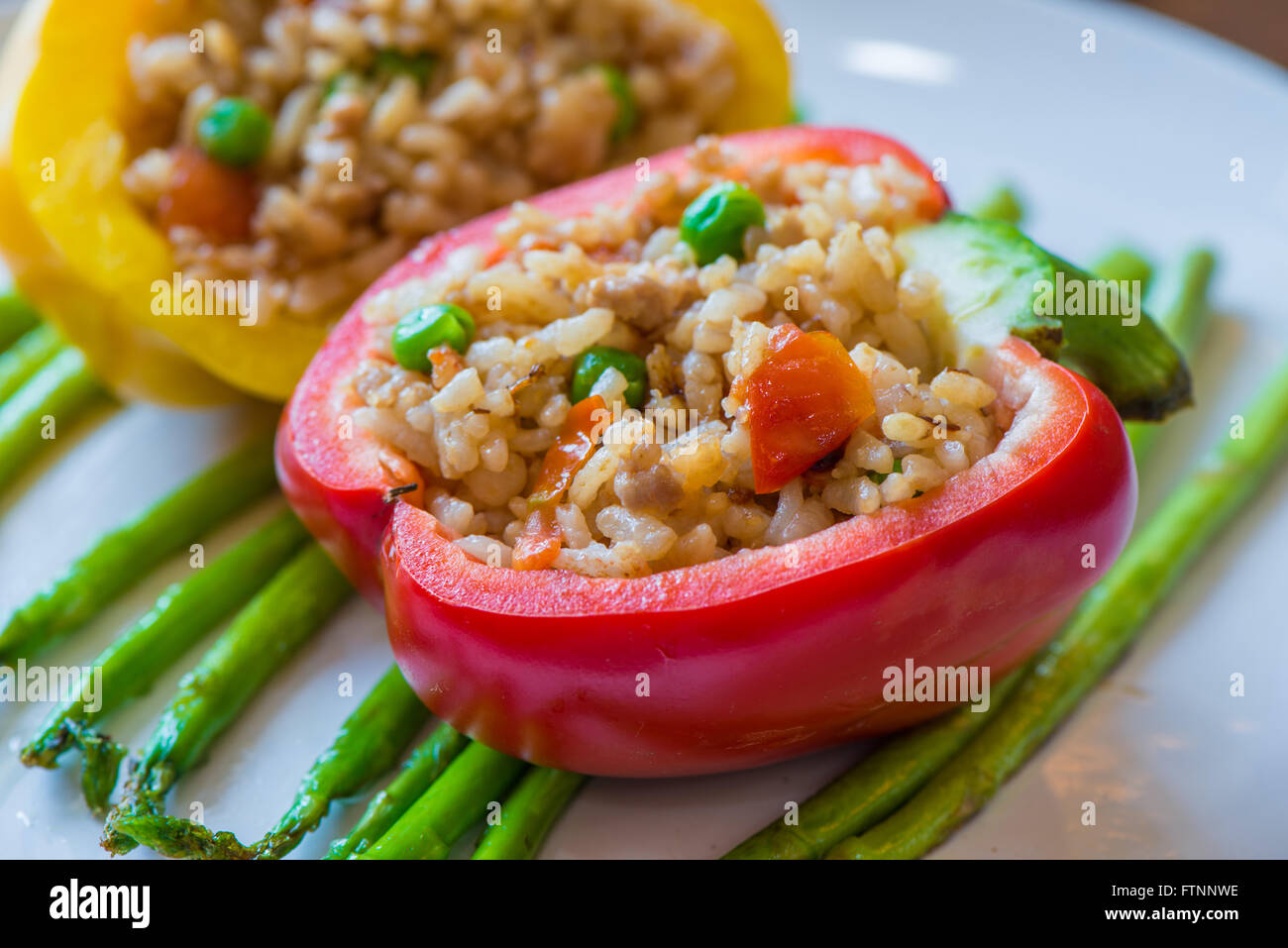 rice pilaf with colorful vegetable in red bell pepper Stock Photo - Alamy