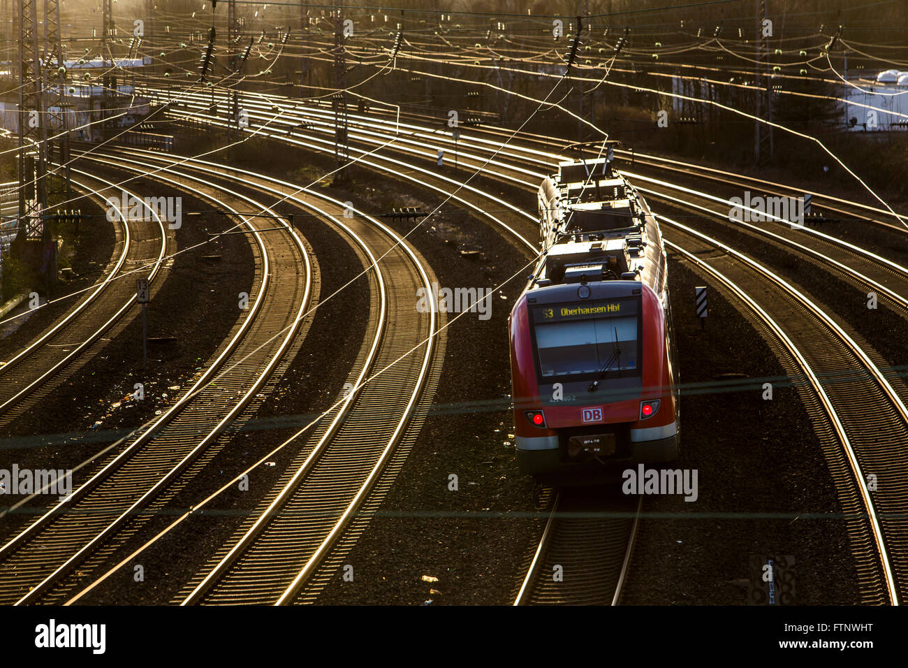 Railroad tracks, reflecting the sunlight, train on tracks Stock Photo ...