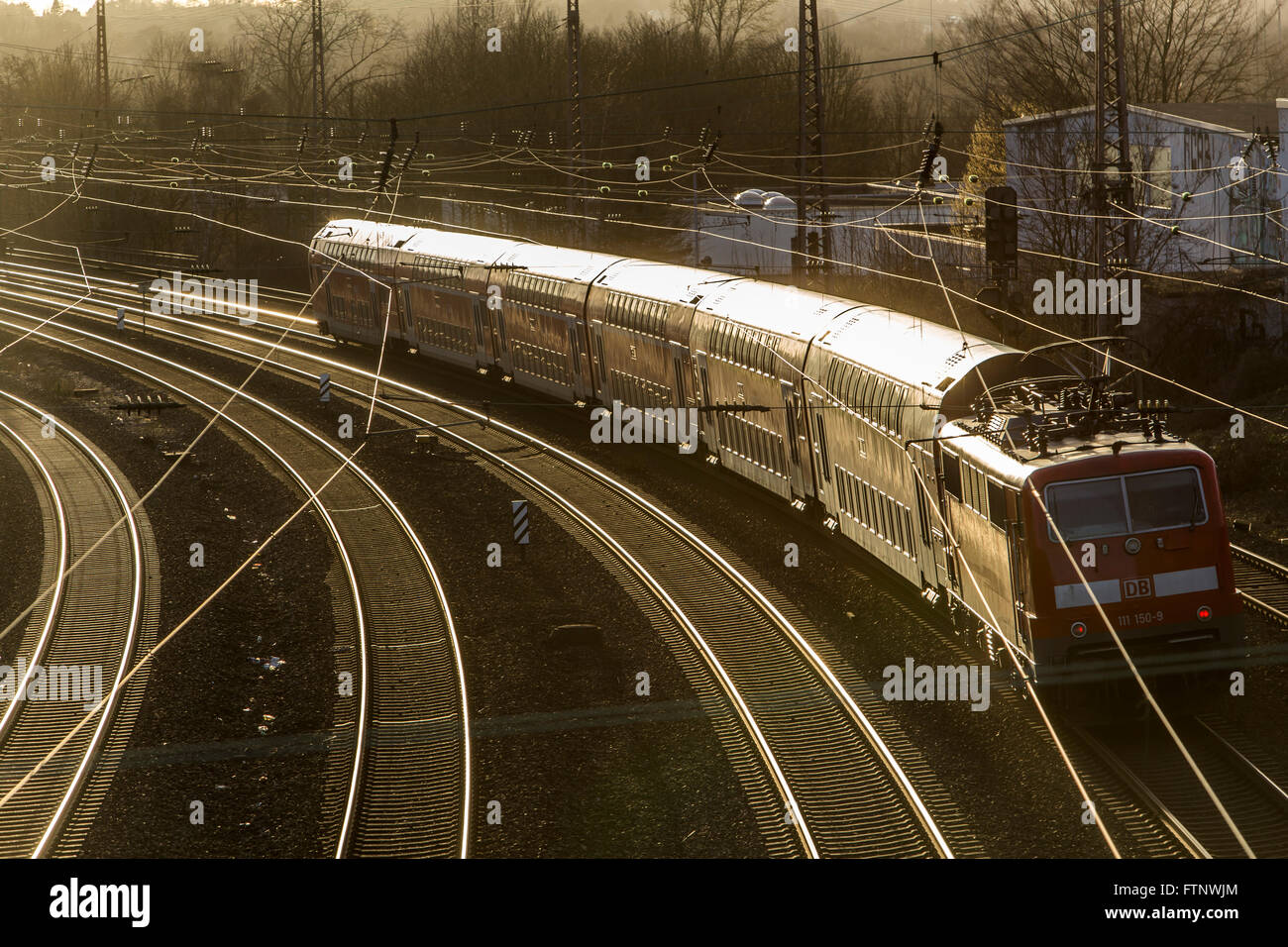 Railroad tracks, reflecting the sunlight, train on tracks Stock Photo ...