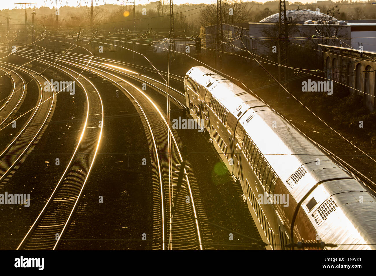 Railroad tracks, reflecting the sunlight, train on tracks Stock Photo ...