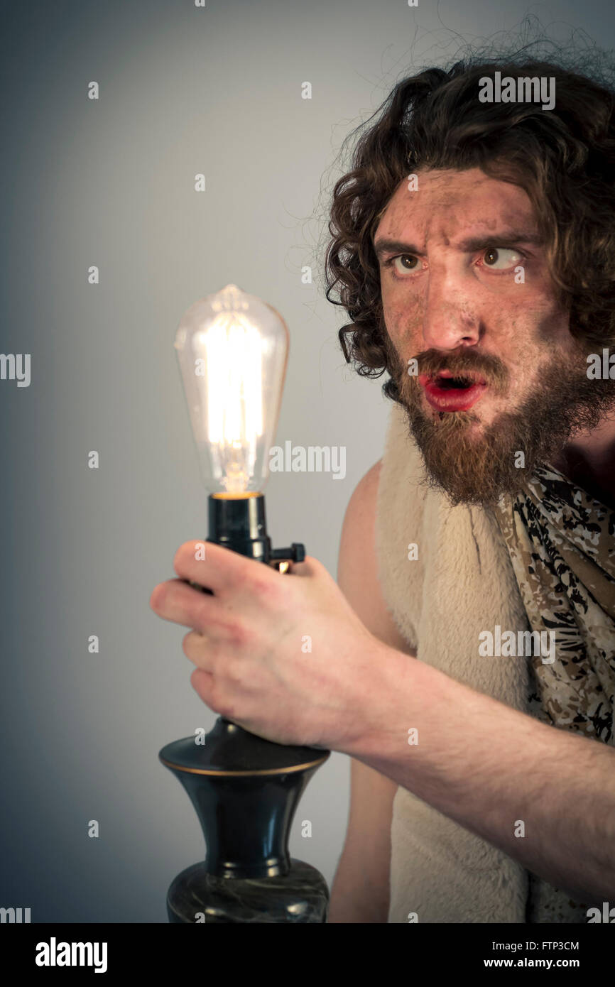 Silly realistic caveman dumbfounded confusing hi-res stock photography ...
