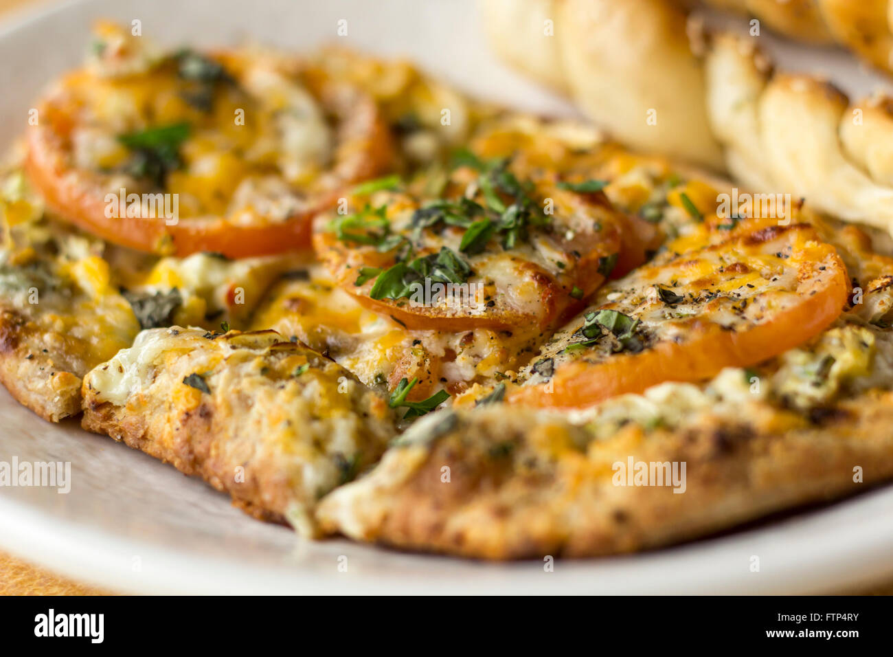 Personal size flatbread authentic margherita pizza with fresh tomatoes ...