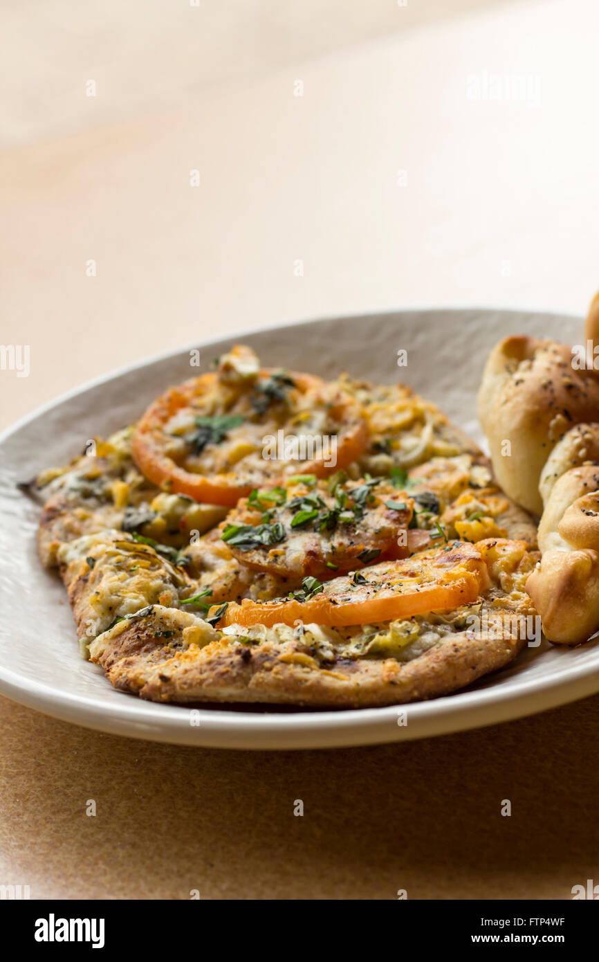 Personal size flatbread authentic margherita pizza with fresh tomatoes ...