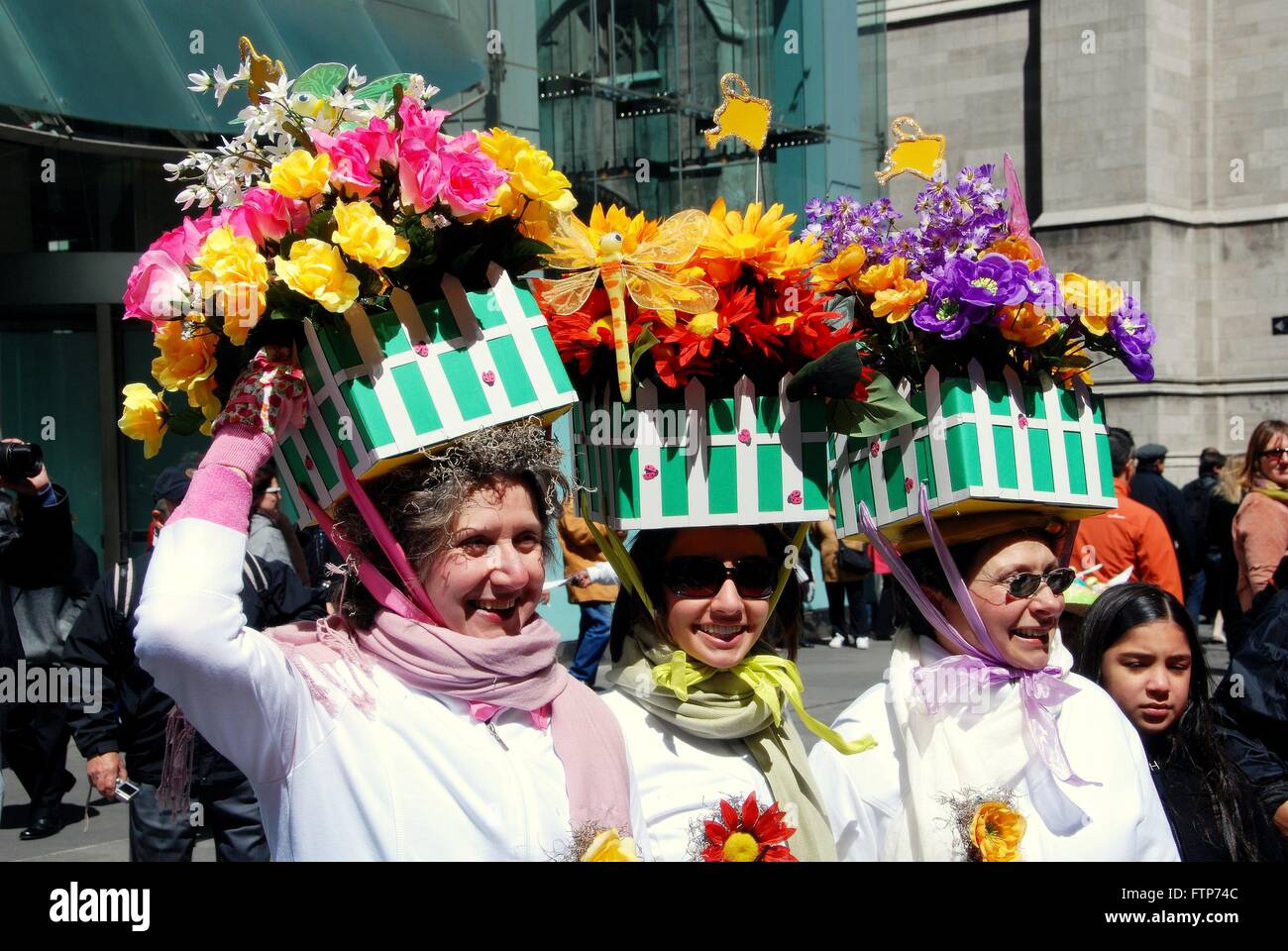 New York City: A trio of women sporting colourful flower bonnets at the ...
