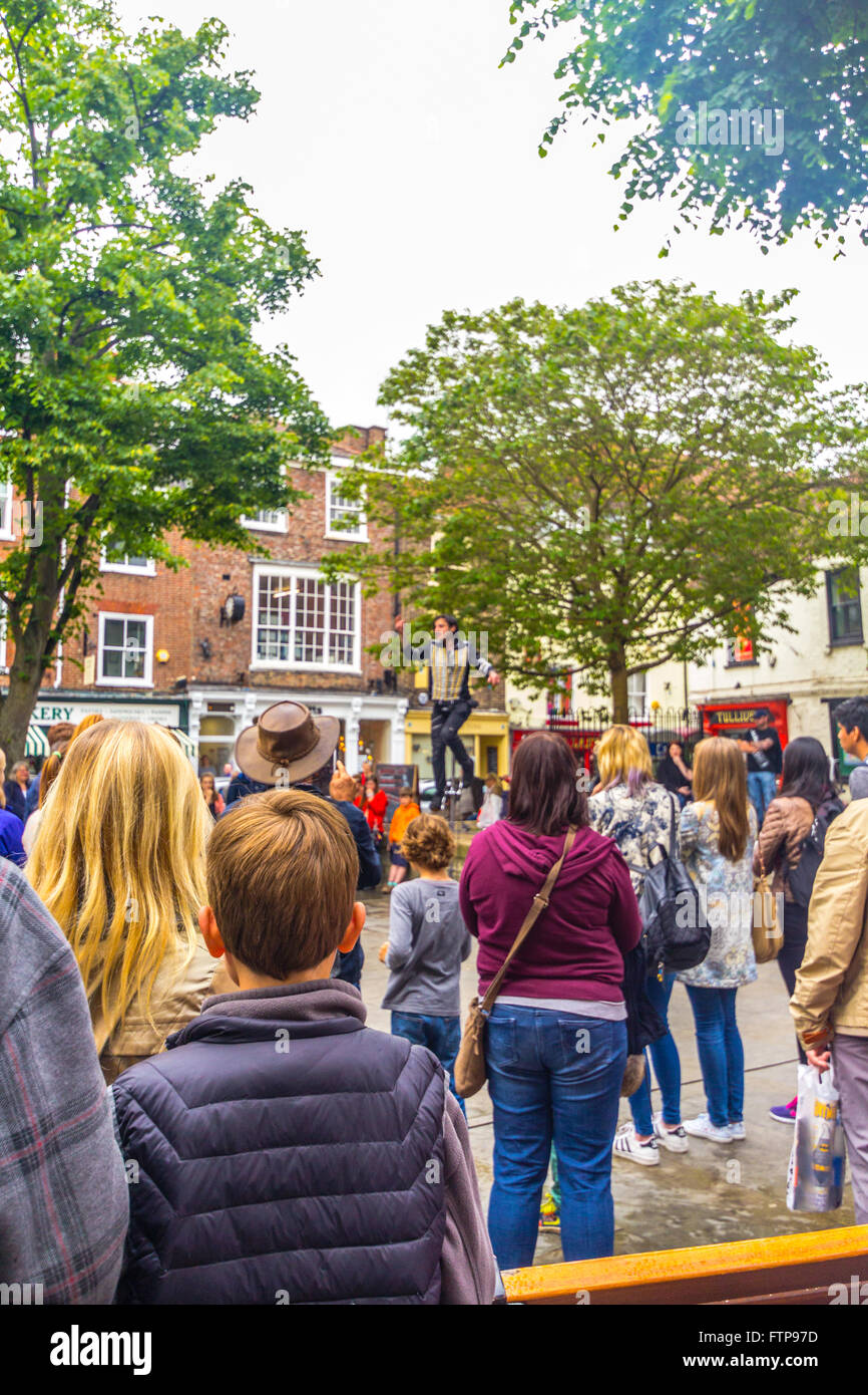 Tourists watching street performance in York, England, United Kingdom ...