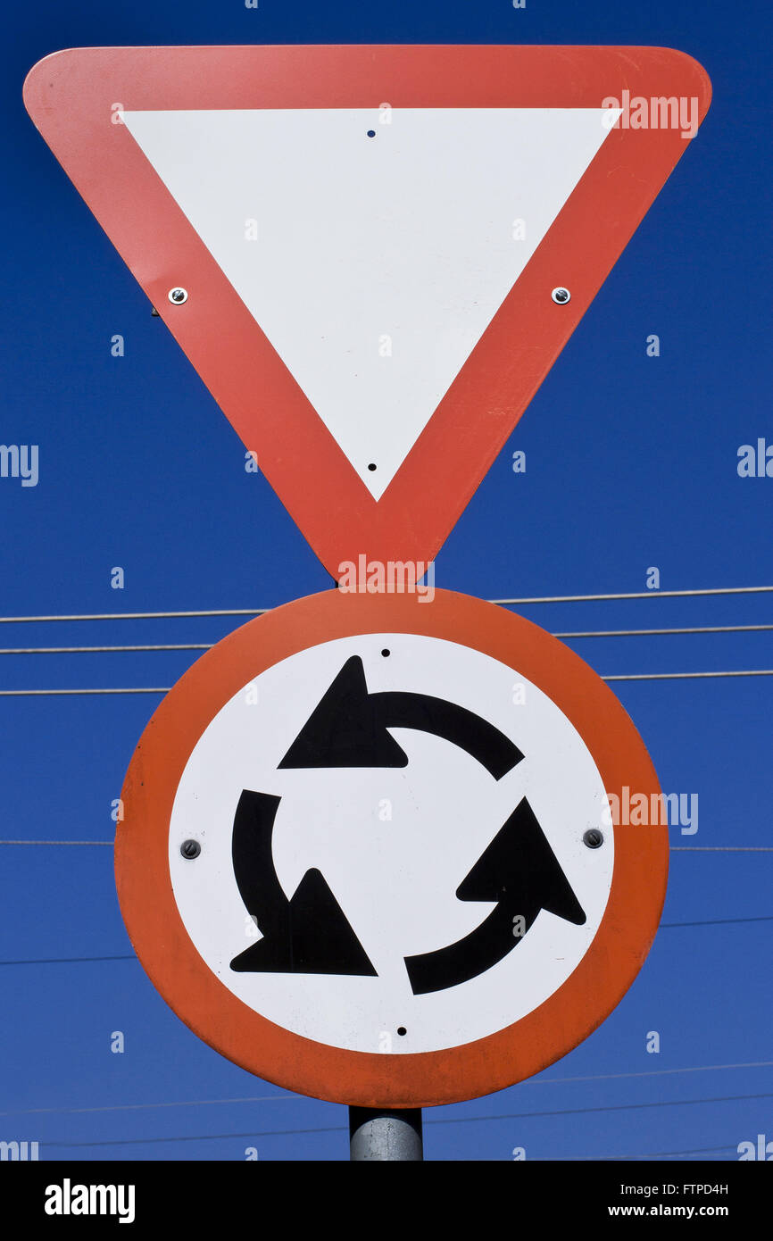 Board indicating preferred transit route and rotatory Stock Photo - Alamy