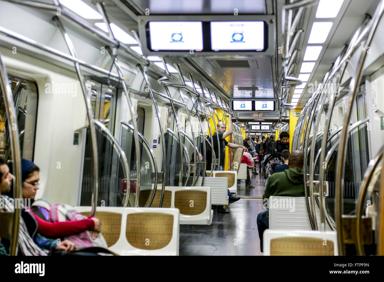 Passengers inside the subway car Yellow Line Stock Photo - Alamy