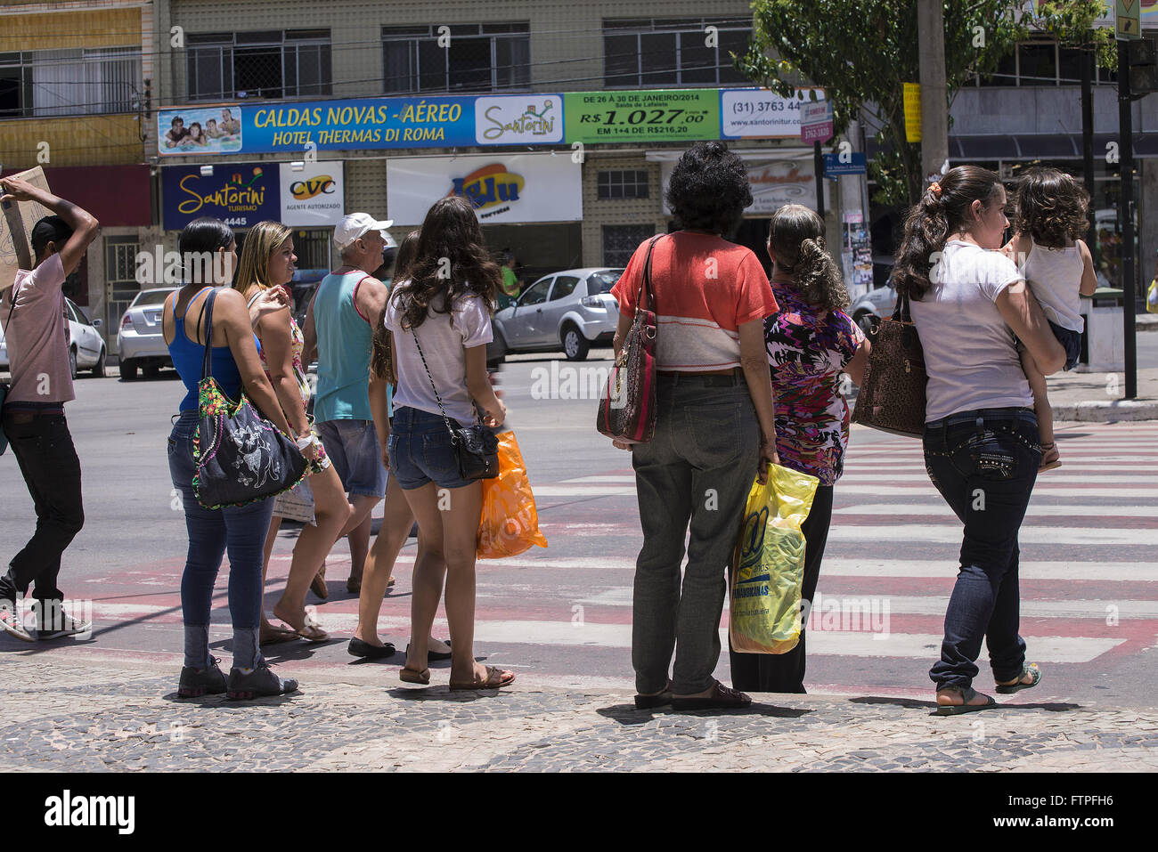 People initiating crossing in the crosswalk avenue in the city center ...