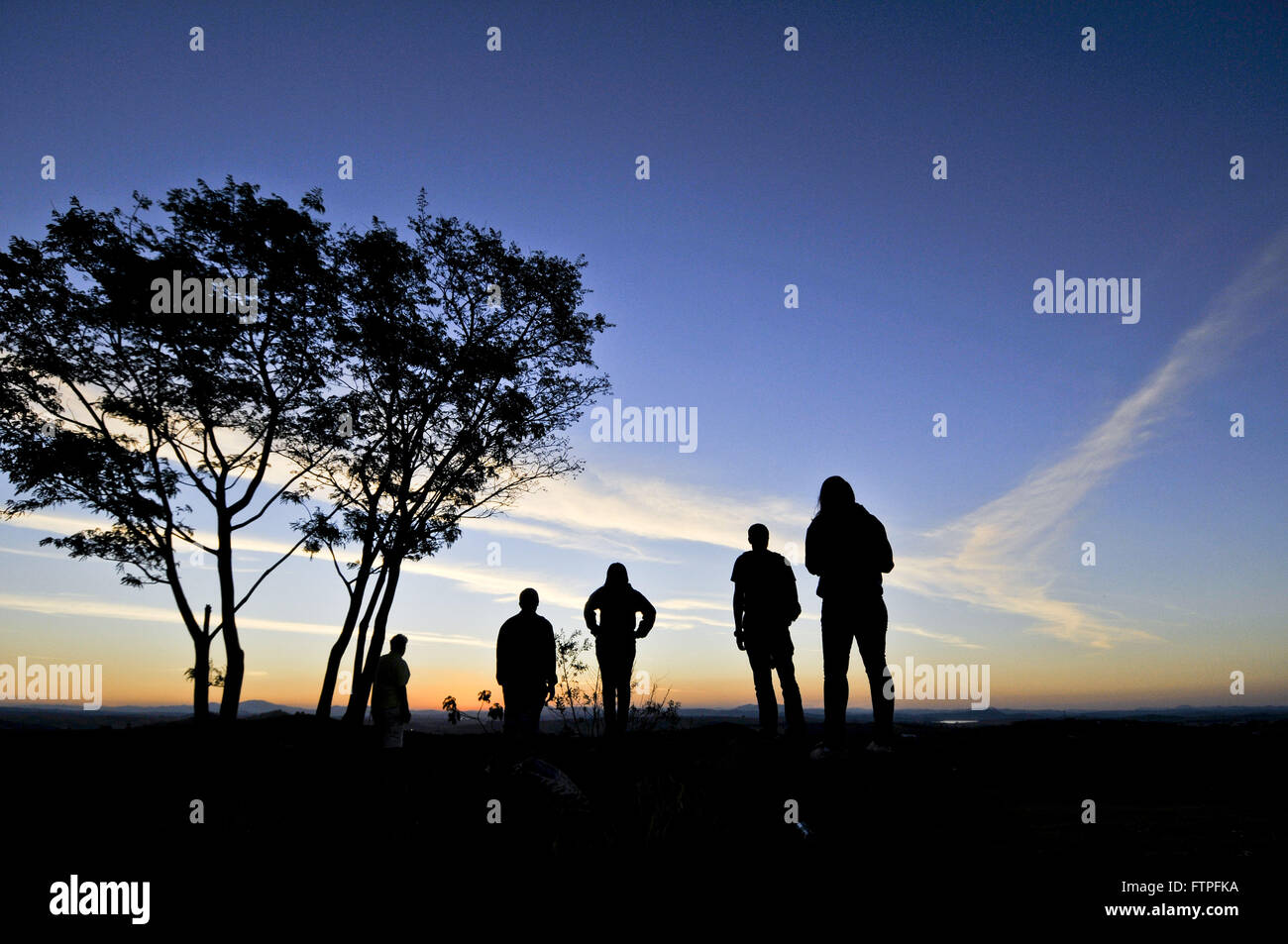 College students contemplating the sunset Stock Photo - Alamy