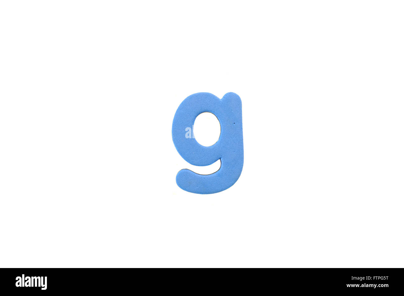 A letter G fridge magnet photographed against a white background Stock ...