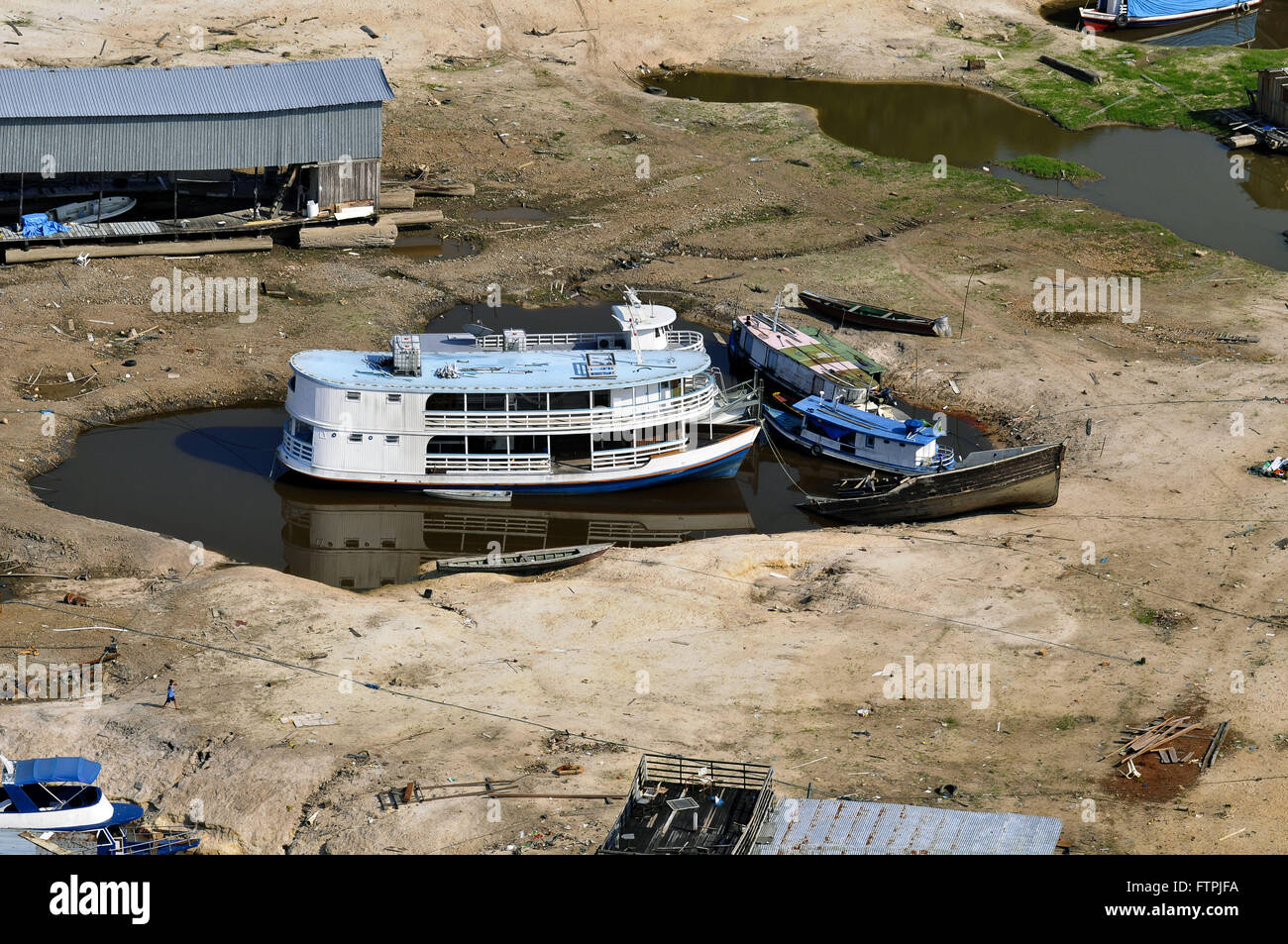 Drought in the Rio Negro - Beached Boats in the marina David Stock ...