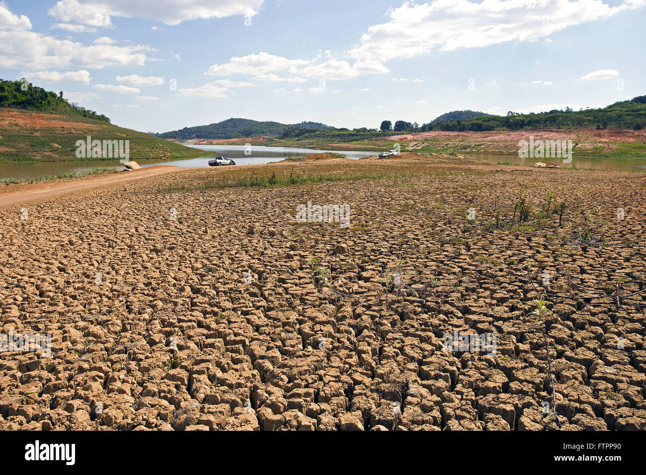 Cracked soil dam formed by the river Jaguari in severe drought period ...