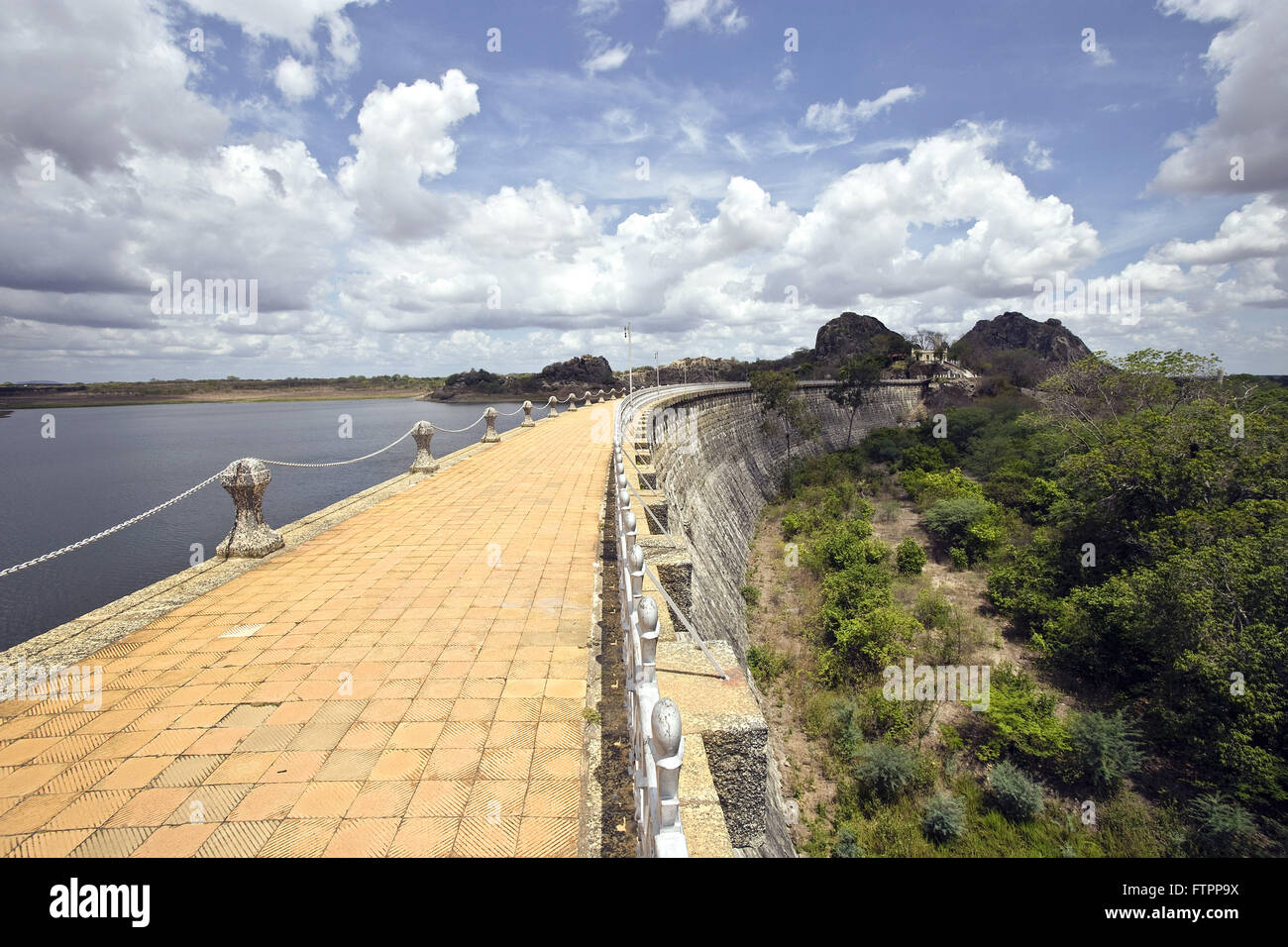 Walkway over the dam Dam Cedar with bars and ashlar with chains Stock ...