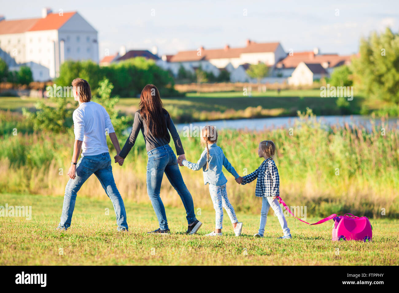 Happy family luggage ready traveling hi-res stock photography and ...