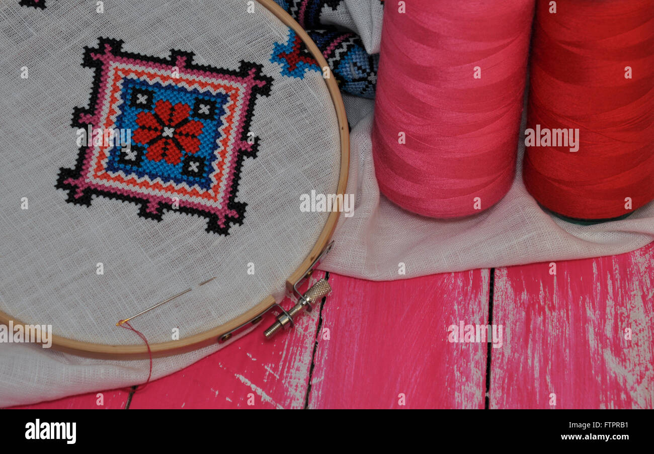 Hand embroidery geometric pattern in wooden hoop Stock Photo - Alamy