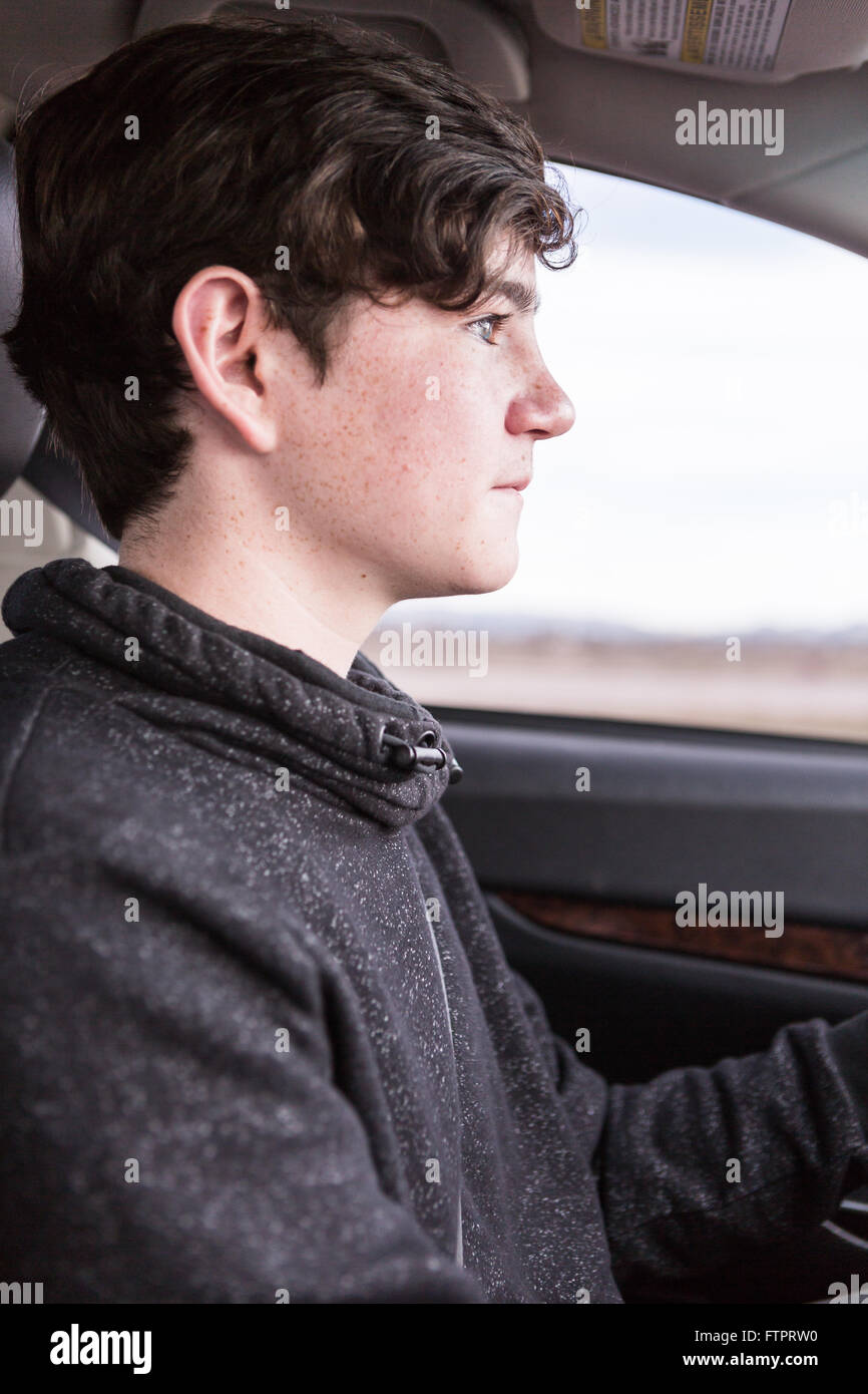 Teenage boy learning to drive on interstate highway Stock Photo - Alamy