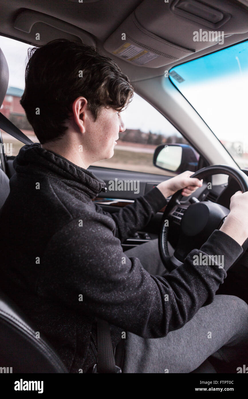 Teenage boy learning to drive on interstate highway Stock Photo - Alamy