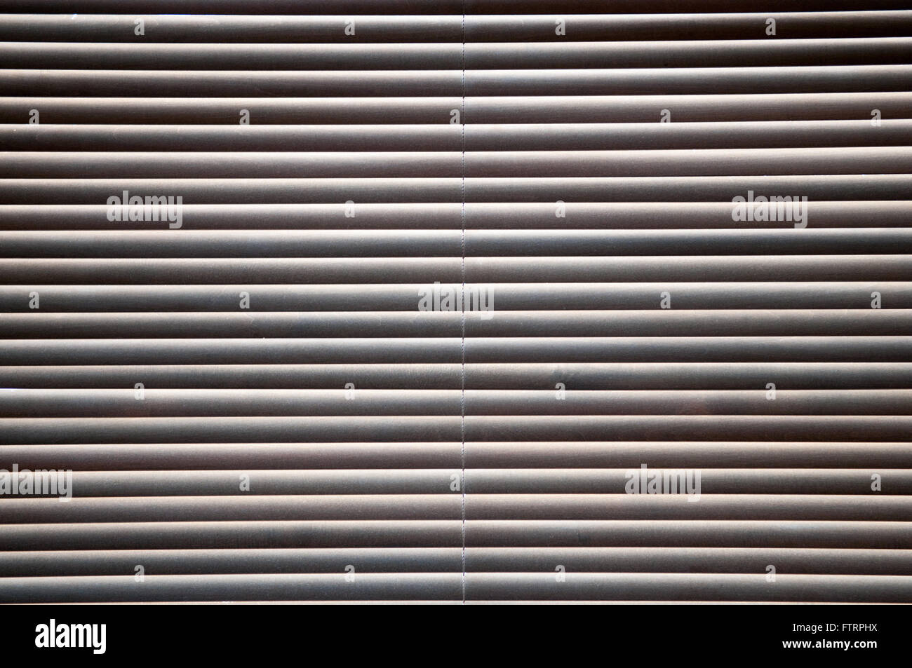 Morning sun shining through closed wooden blinds Stock Photo - Alamy