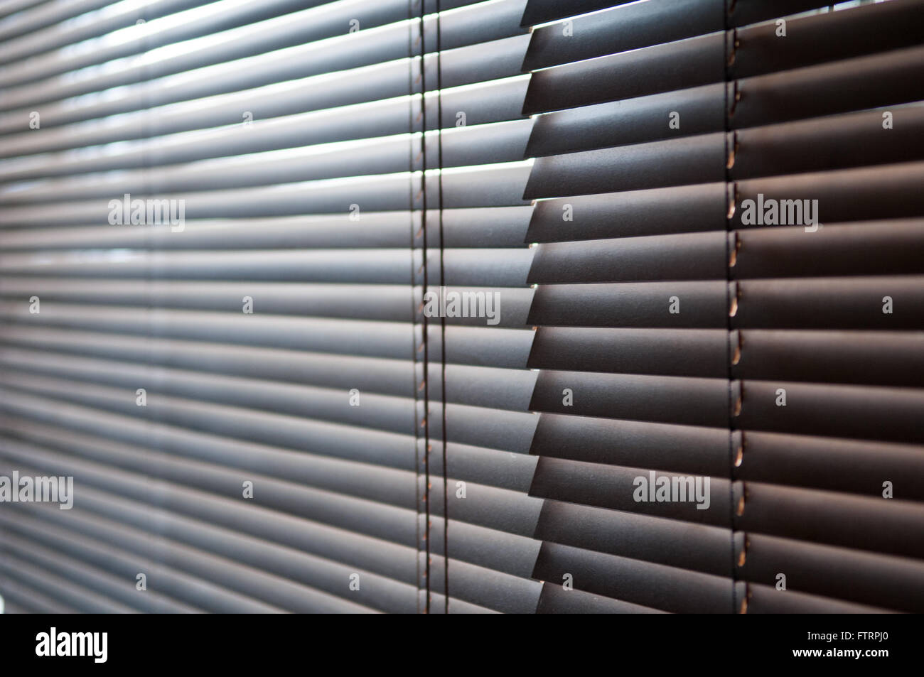 Morning sun shining through closed wooden blinds Stock Photo - Alamy