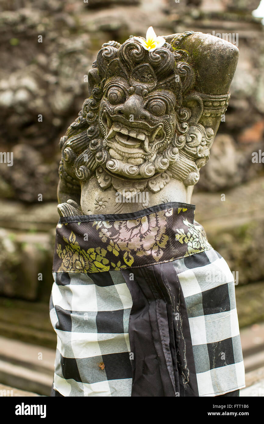 Traditional demon statue carved in stone on Bali, Indonesia Stock Photo ...
