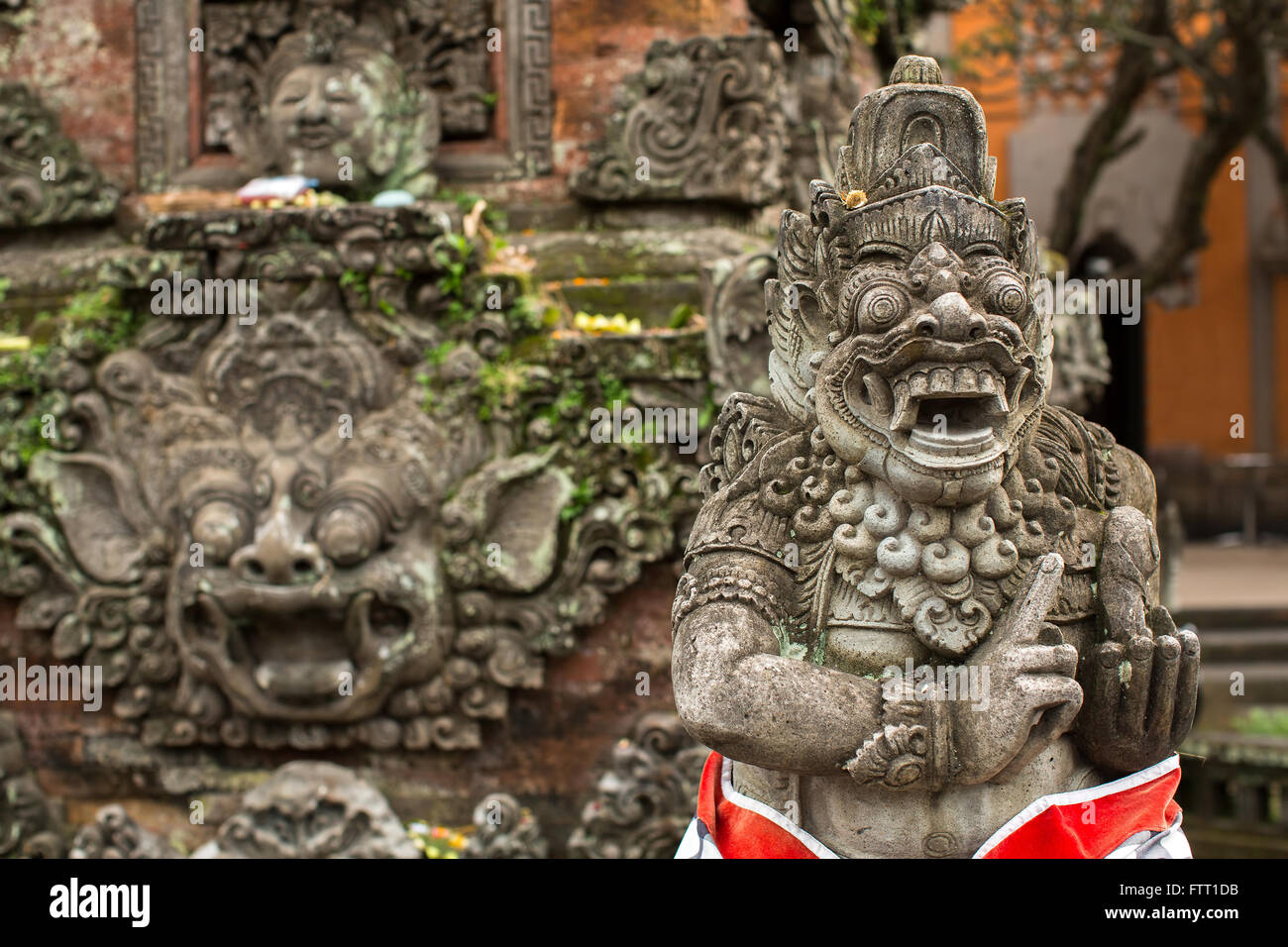 Traditional demon statue carved in stone on Bali, Indonesia Stock Photo ...
