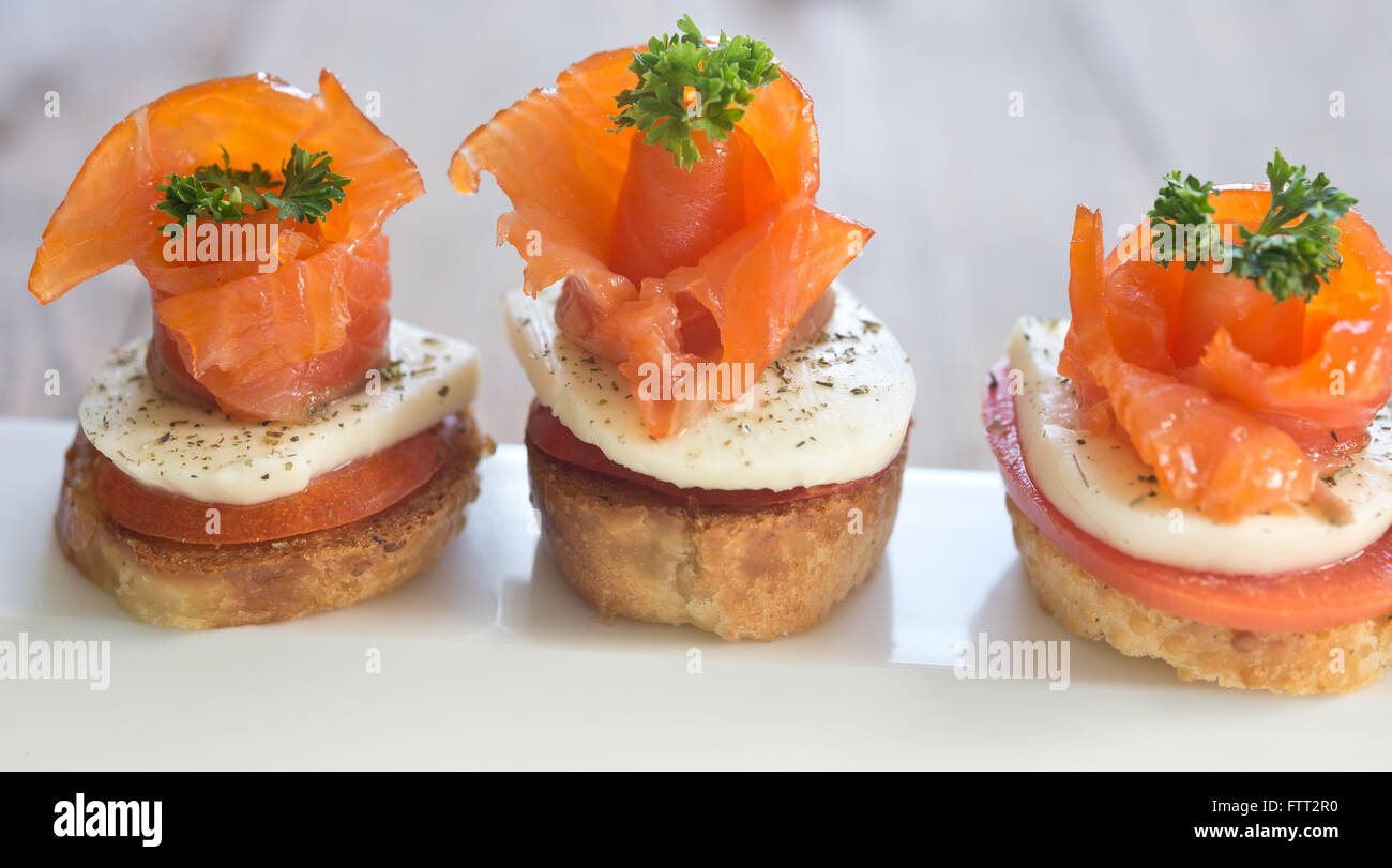 close up shot of canapes with red fish and cheese Stock Photo - Alamy