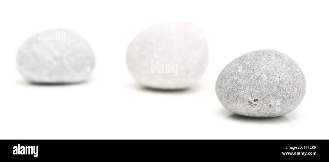 round stones isolated on a white background Stock Photo - Alamy