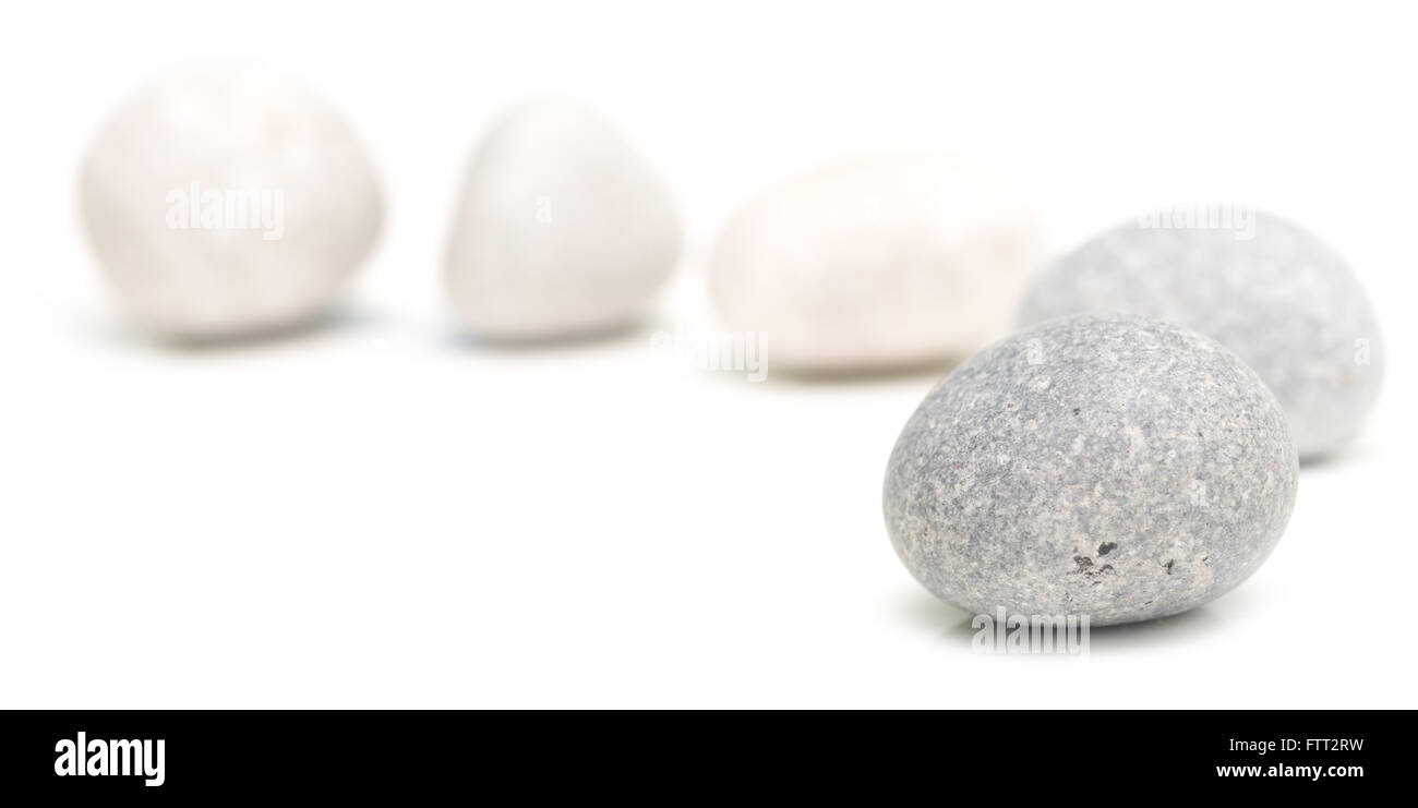 round stones isolated on a white background Stock Photo - Alamy