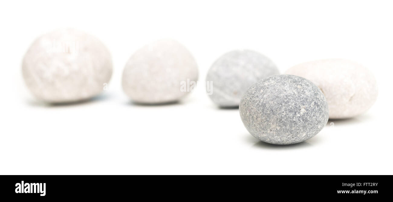 round stones isolated on a white background Stock Photo - Alamy