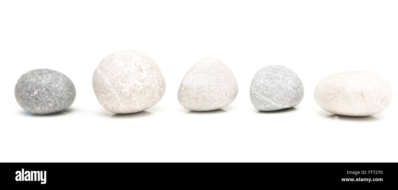 round stones isolated on a white background Stock Photo - Alamy