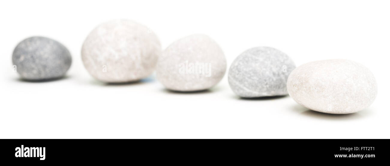 round stones isolated on a white background Stock Photo - Alamy