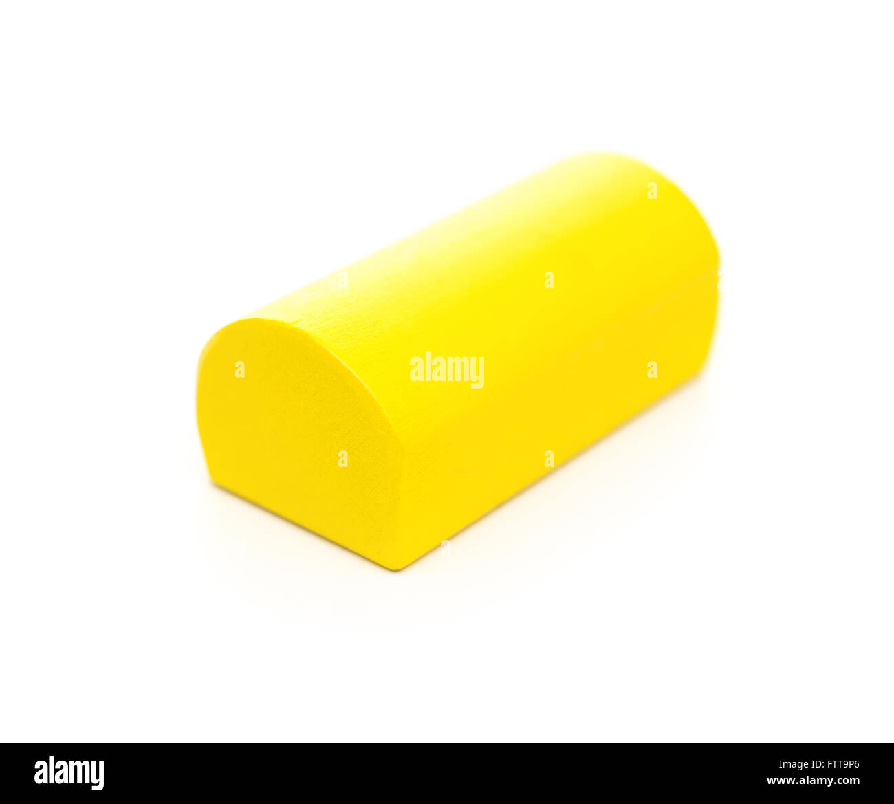 piece of yellow wooden toy block on white background Stock Photo - Alamy