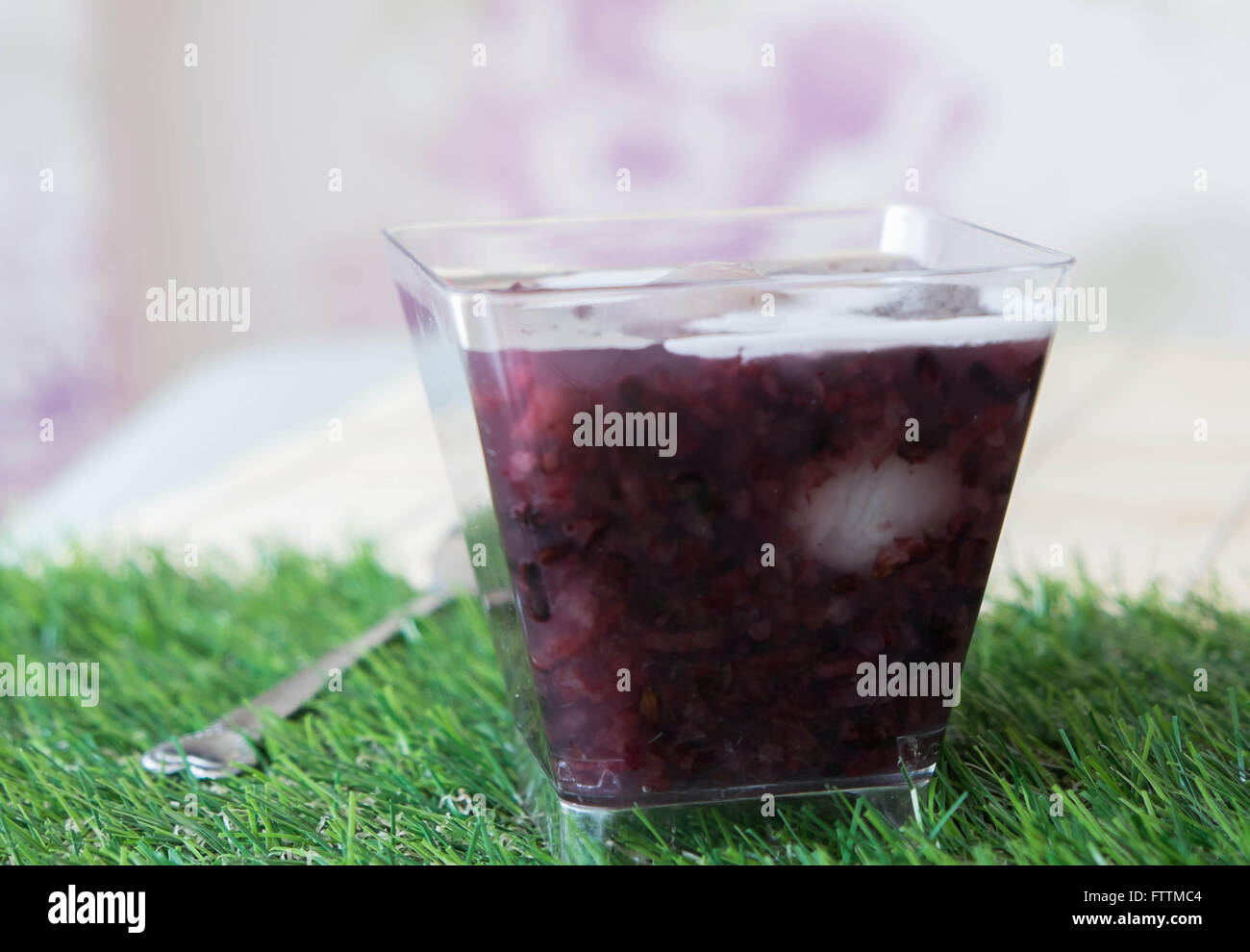 Thai dessert, black sticky rice pudding with longan and coconut cream ...