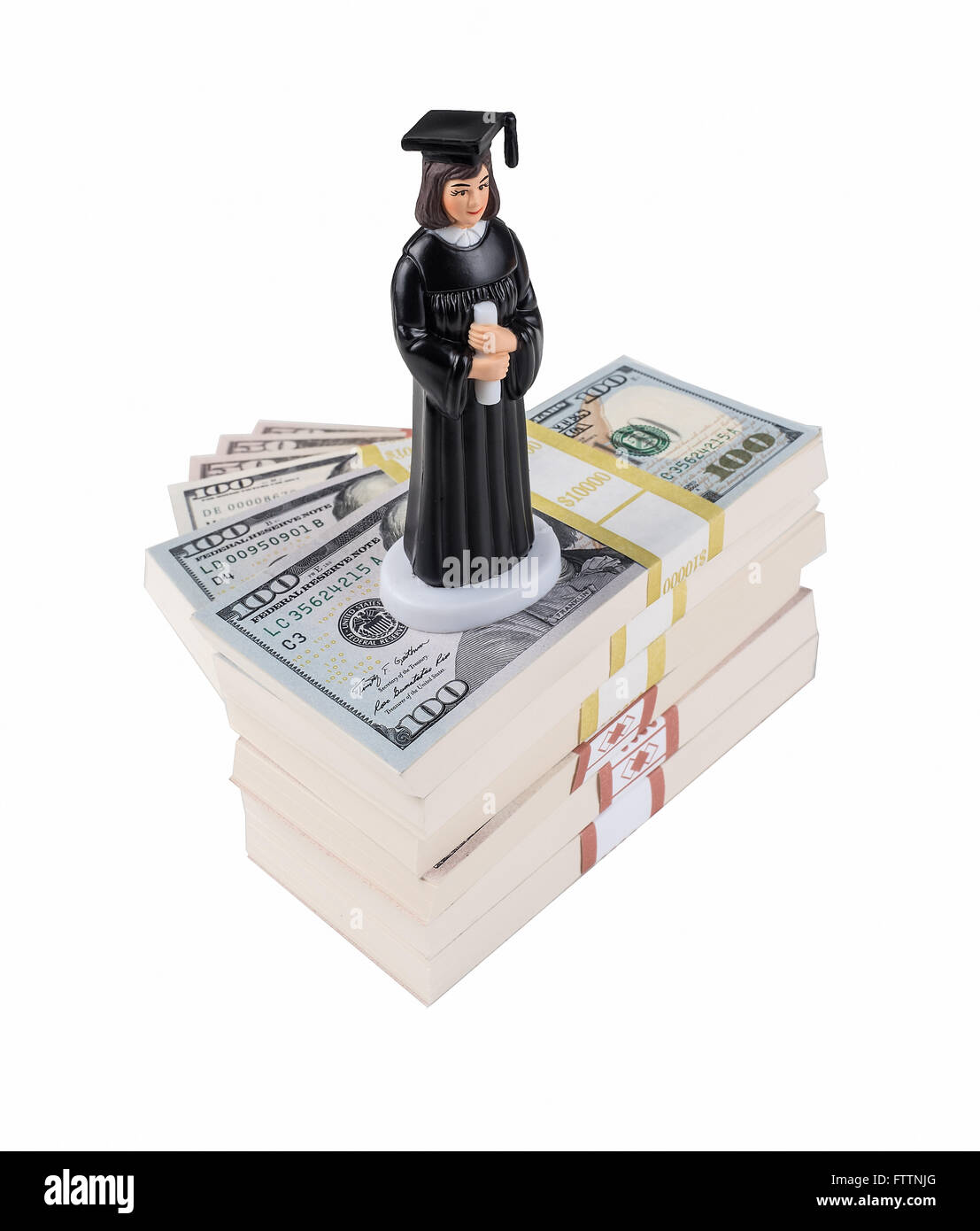 Photograph of female graduate figurine in cap and gown standing on top ...