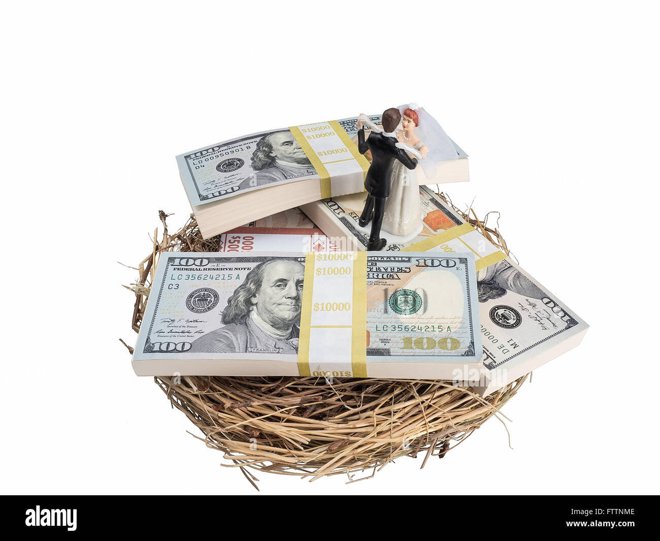 Photograph of bride and groom figurines dancing on top of stacks of U.S ...