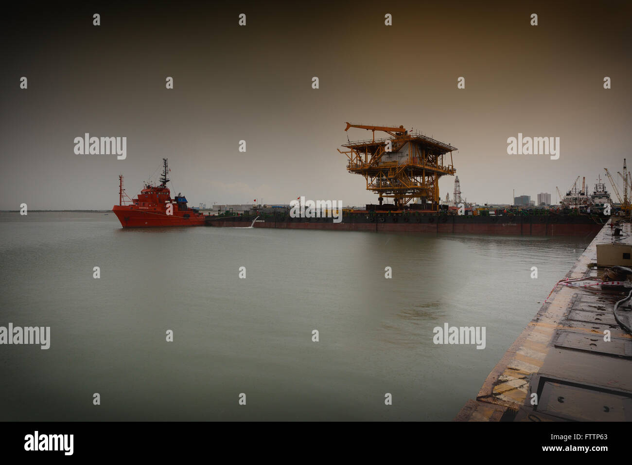 An oil rig topside on a barge before sailing away Stock Photo - Alamy