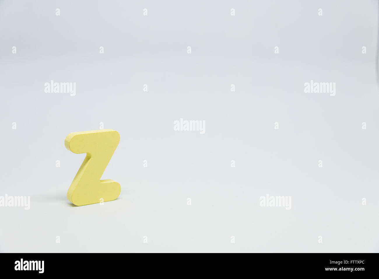 Yellow Wooden alphabet Z with white background Stock Photo - Alamy