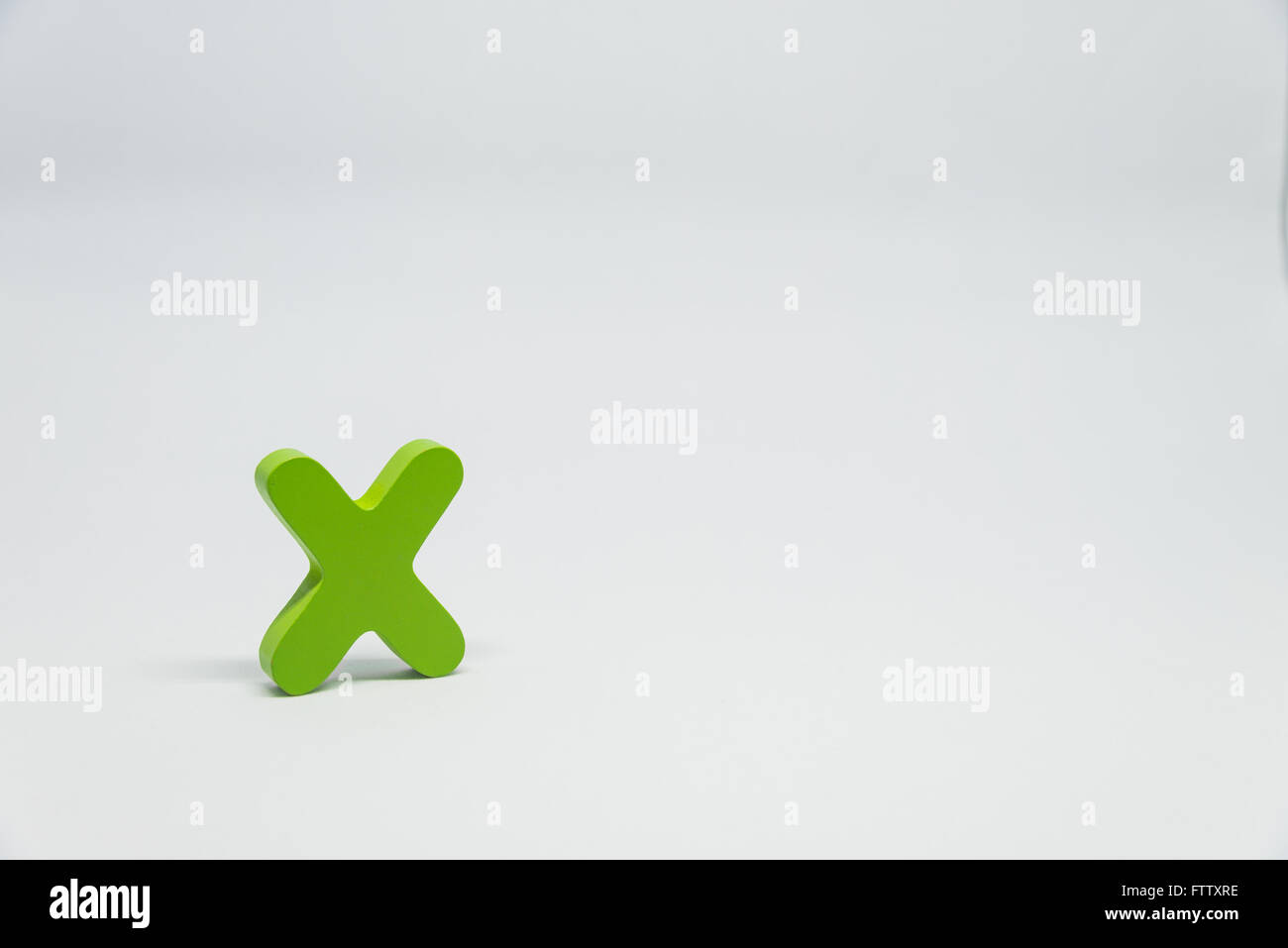 Green Wooden alphabet X with white background Stock Photo - Alamy