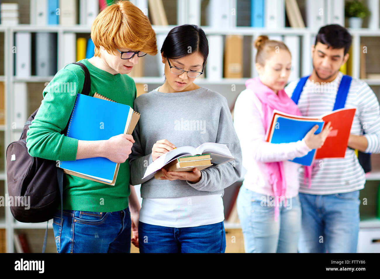 Group reading hi-res stock photography and images - Alamy